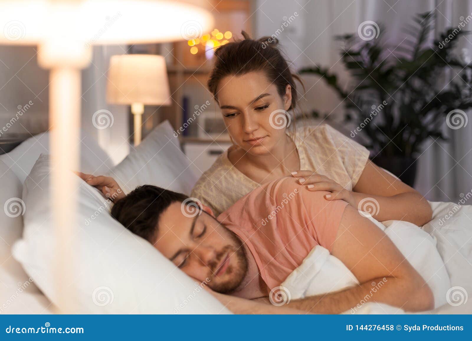 Woman Wakes Her Sleeping Husband Up in Bed at Home Stock Photo - Image ... Woman Wakes Her Sleeping Husband Up in Bed at Home Stock Photo - Image ...