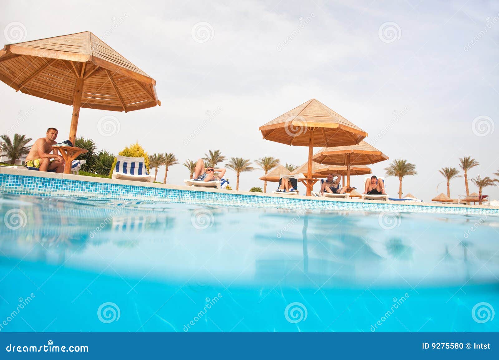 People Resting Near Swimming Pool Stock Photo - Image of beautiful ...