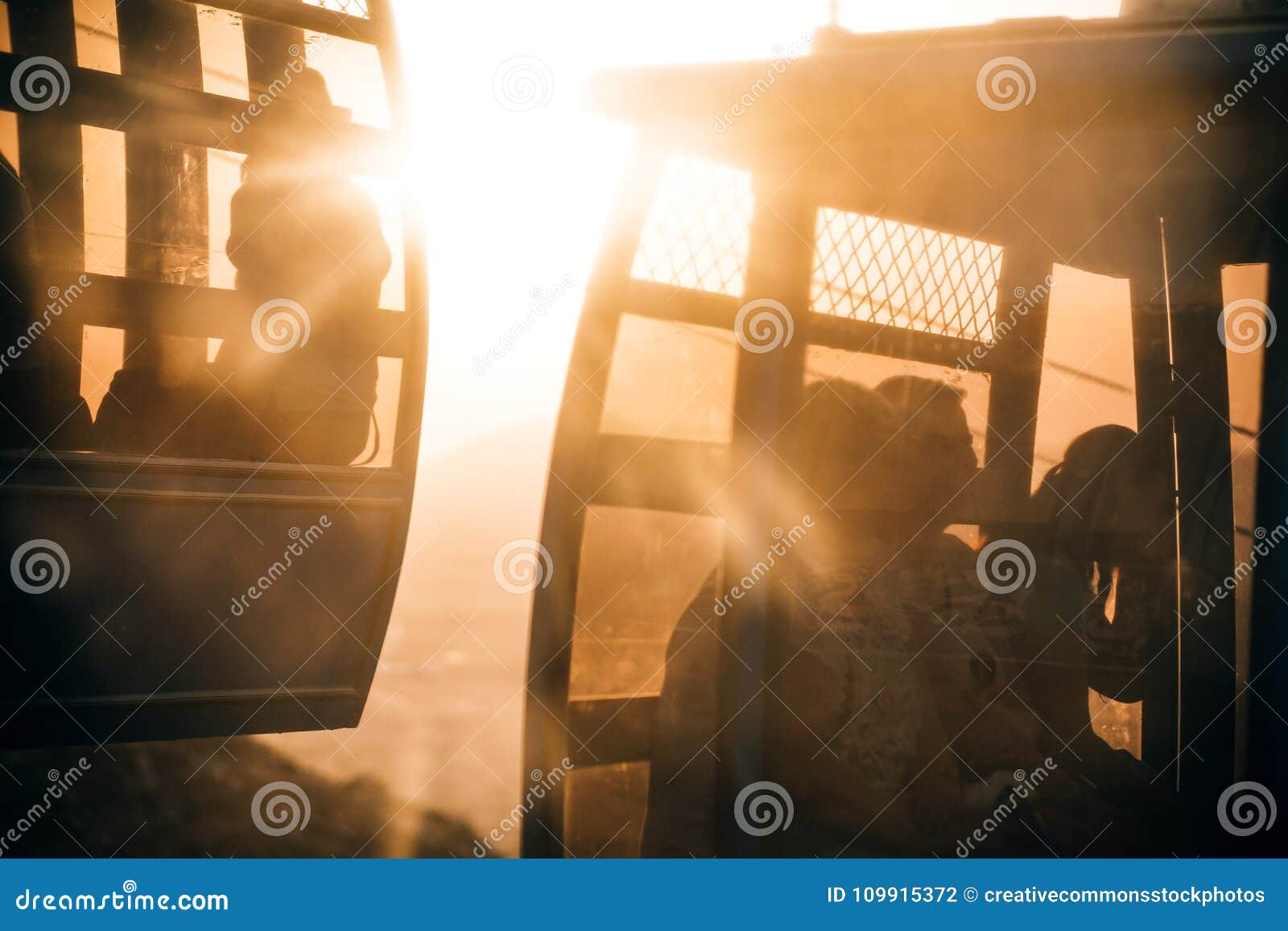 People Riding Cable Carts During Sunset Picture. Image: 109915372