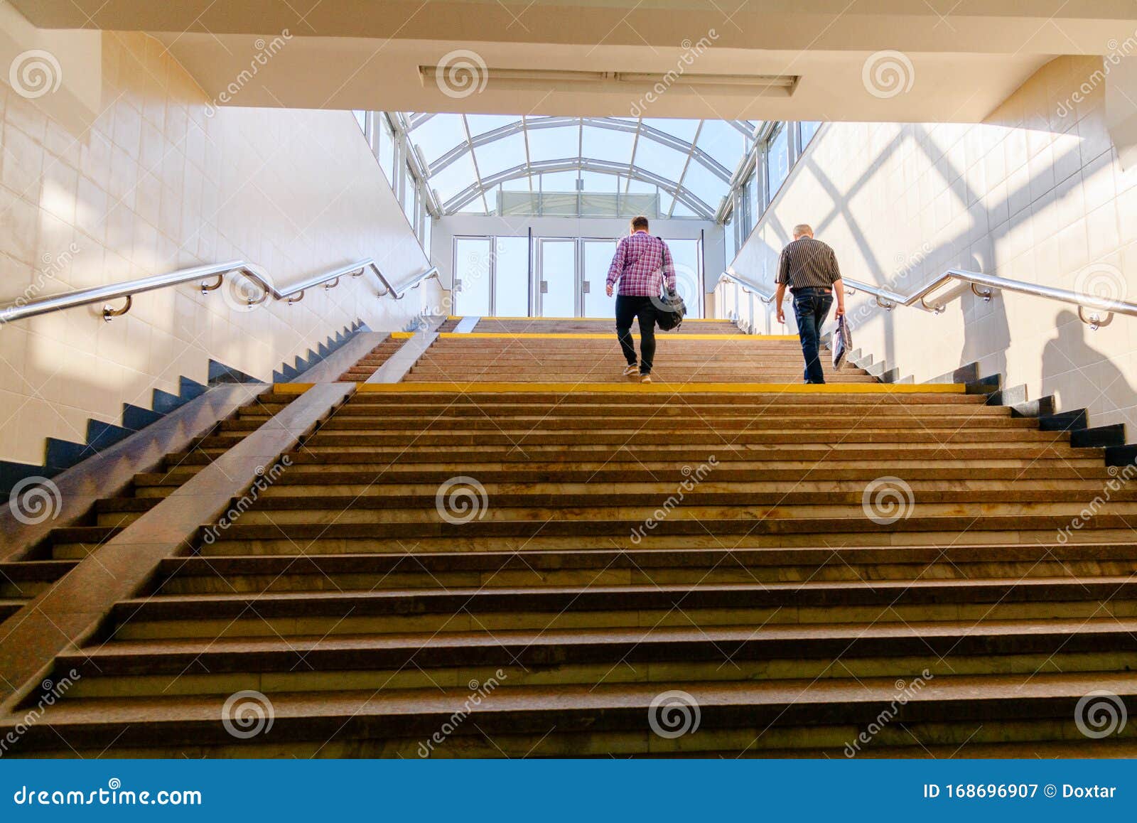People rise on steps editorial photography. Image of business - 168696907
