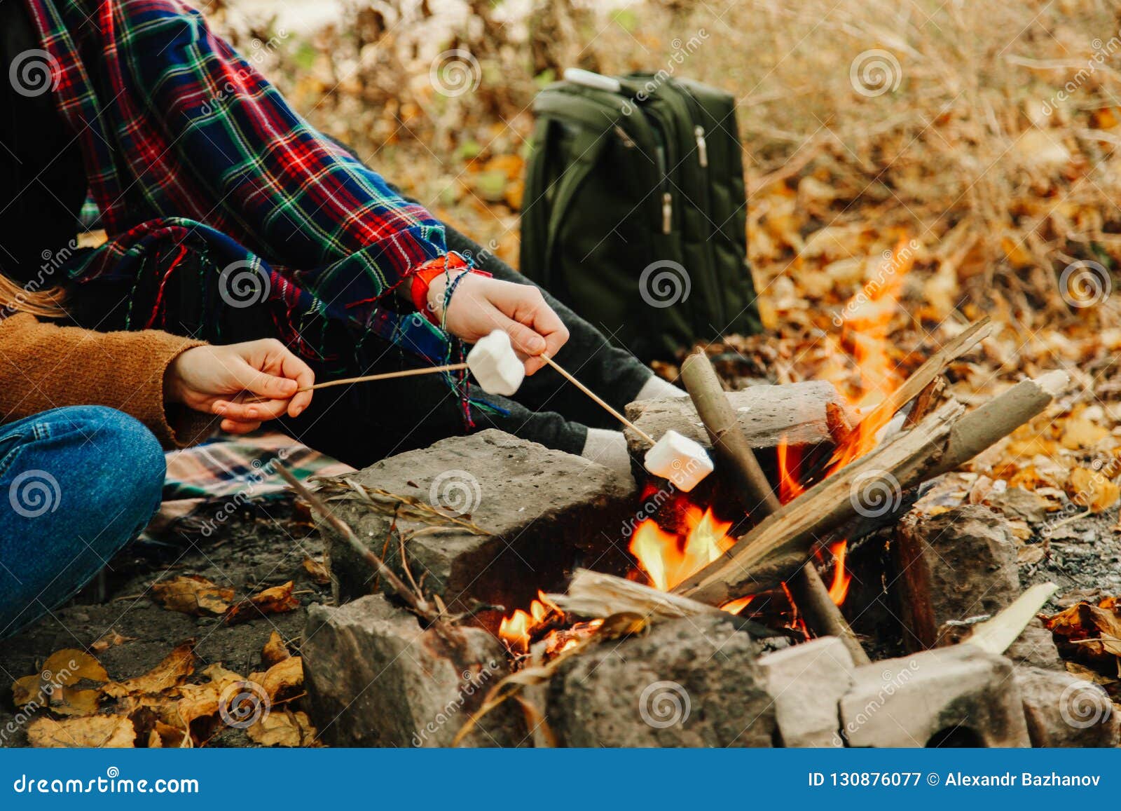 People roast marshmallows stock image. Image of marshmallow - 130876077