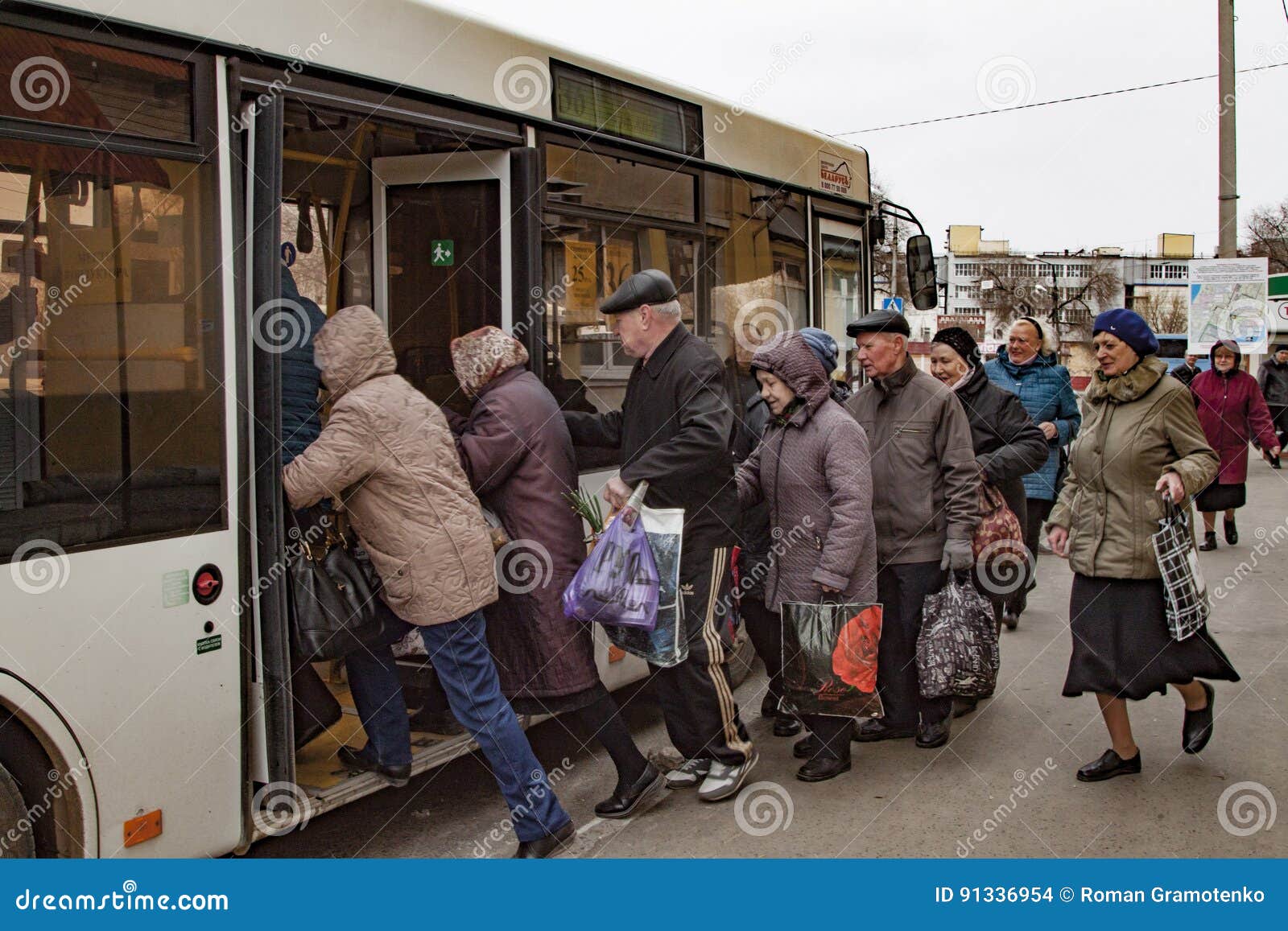Crowd of People Getting on the Bus in Autumn in Europe Editorial Stock ...