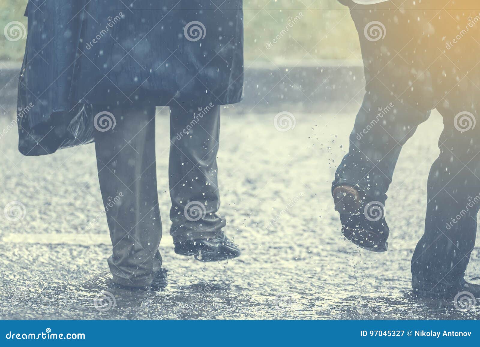 People Running Away through Puddle at Street during Heavy Rain. Stock ...