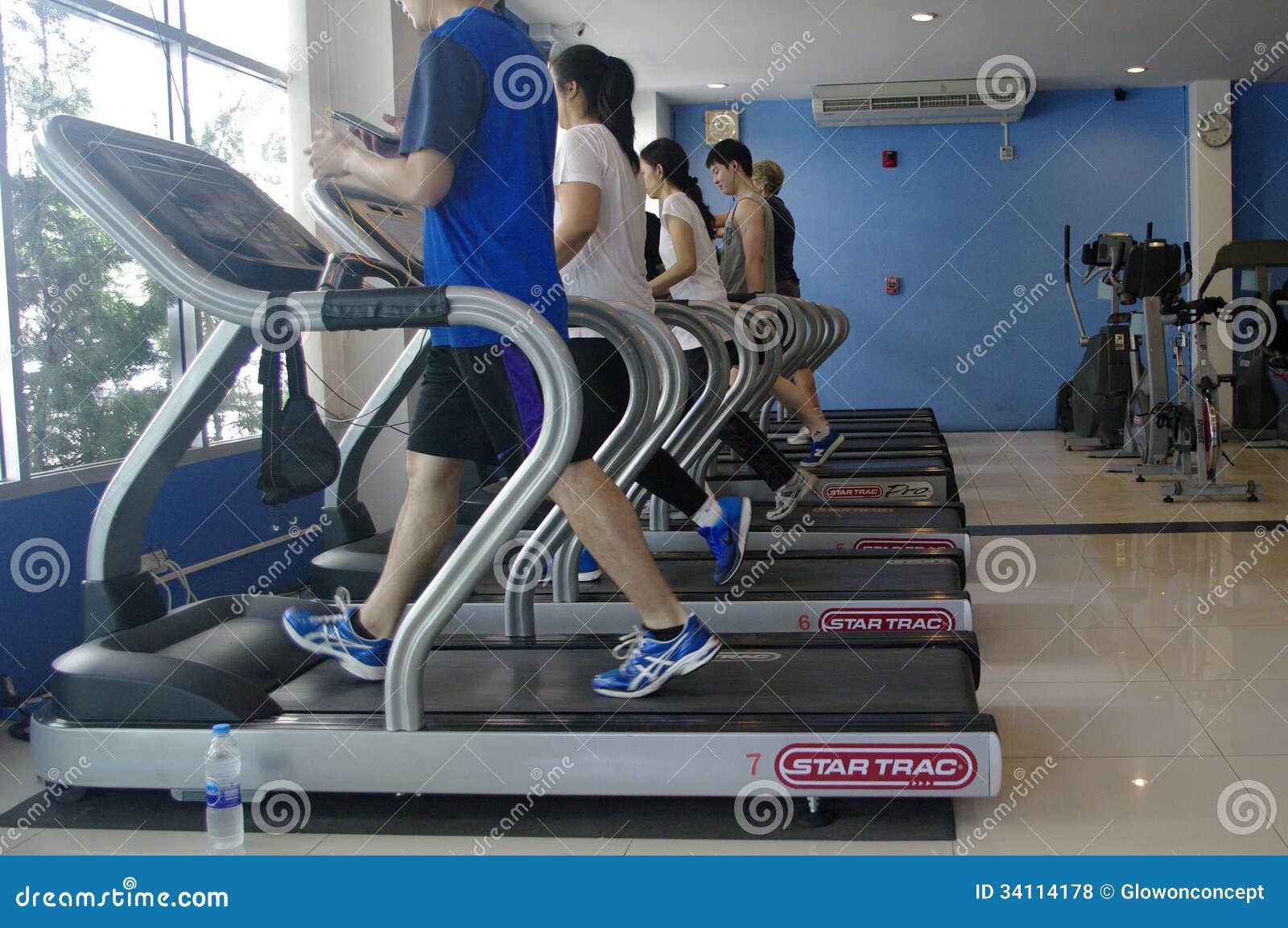People running at the gym editorial stock photo. Image of body - 34114178