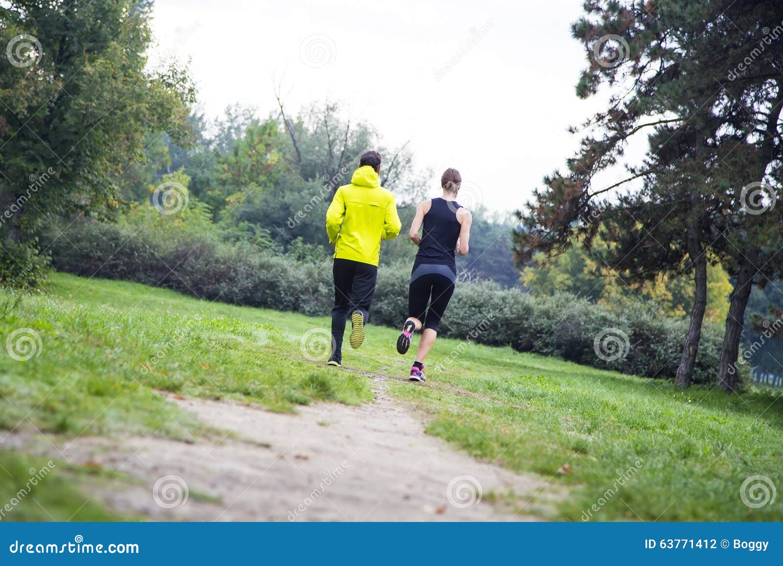 People running in the park stock photo. Image of female - 63771412