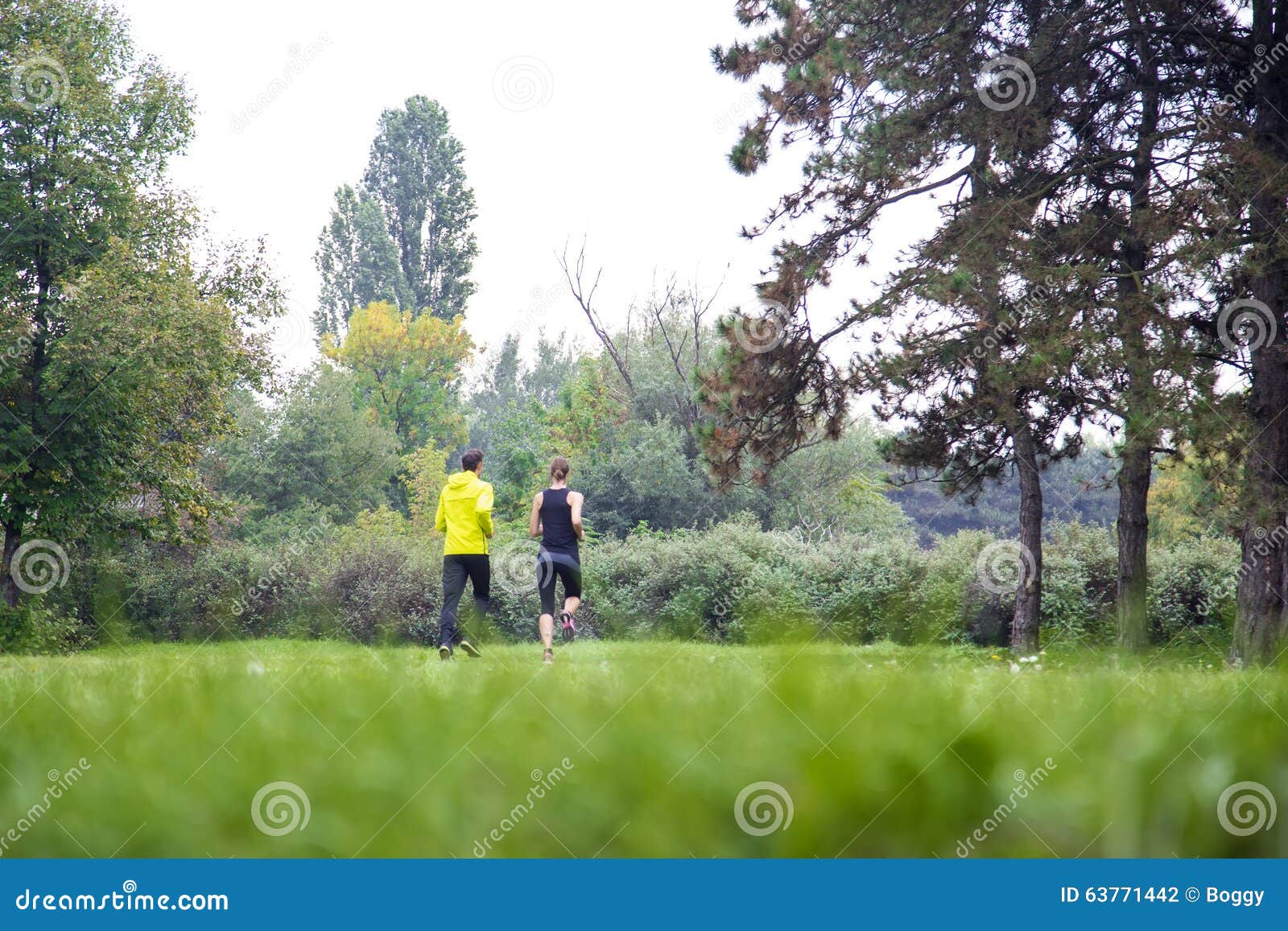 People running in the park stock photo. Image of runner - 63771442