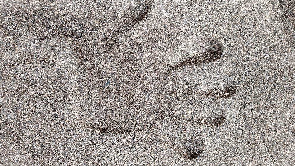 PEOPLE S HANDS TRAPS on the SAND Stock Image - Image of brown, texture ...