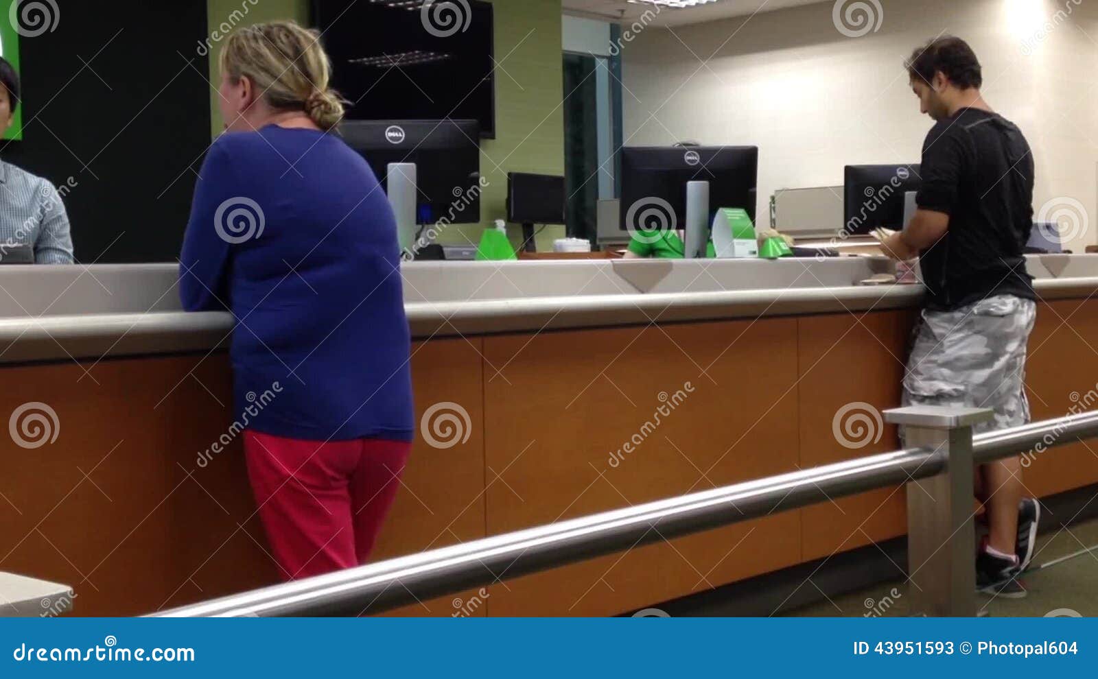 People at a Service Counter Talking To the Teller Stock Video - Video ...