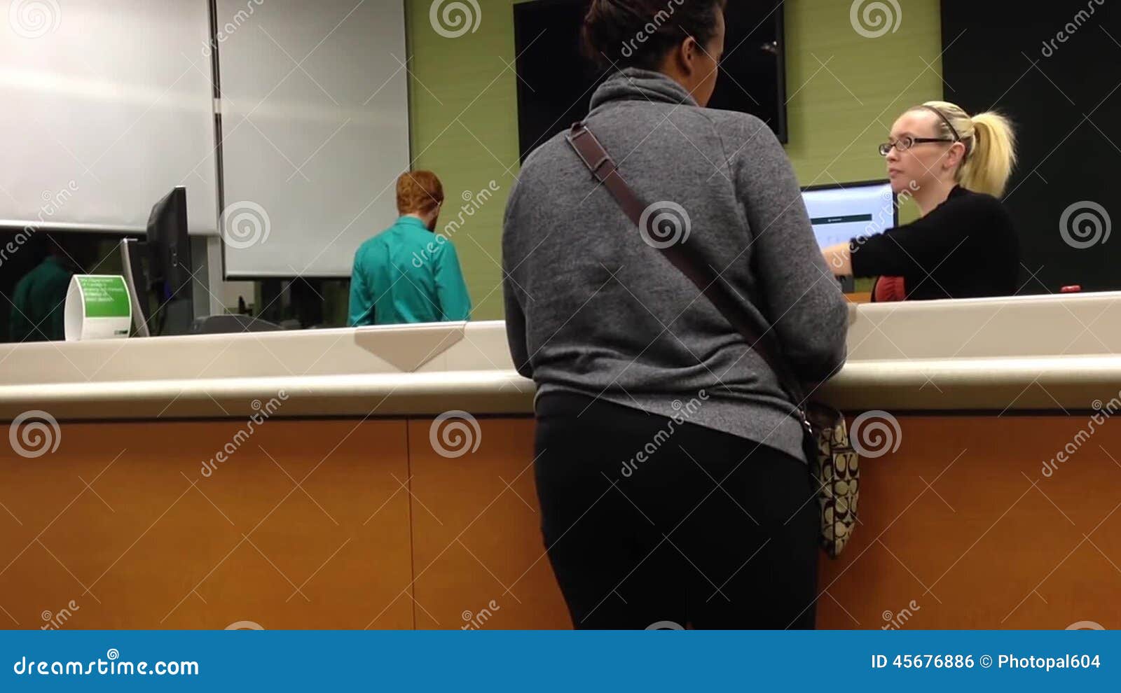 People at a Service Counter Talking To the Teller Stock Footage - Video ...