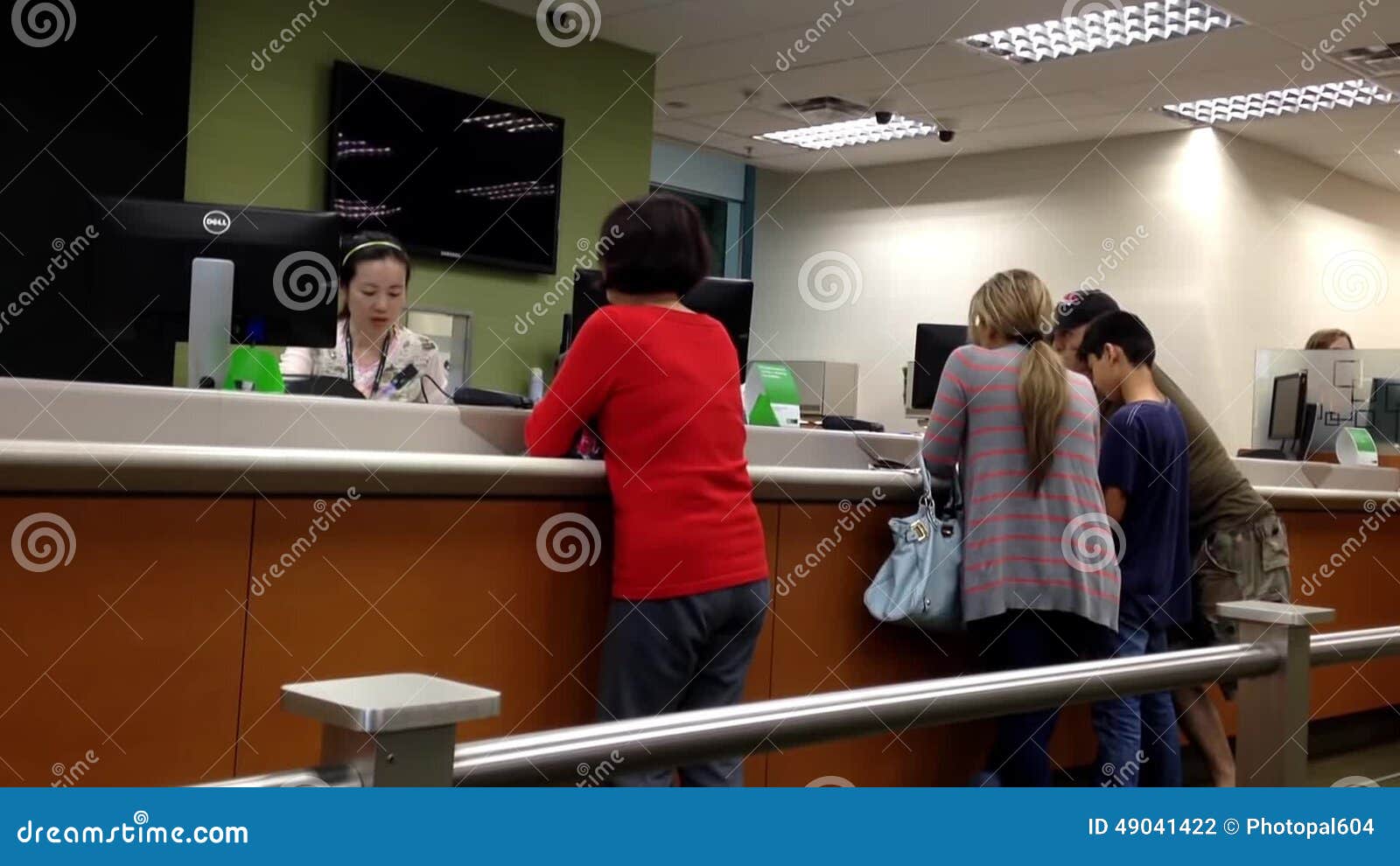 People at a Service Counter Talking To the Teller Stock Footage - Video ...