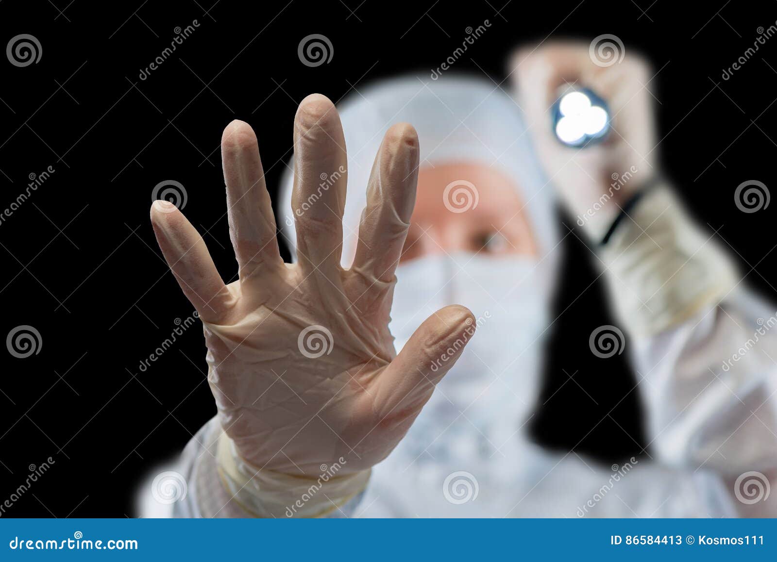 People Shines a Flashlight in Protective Clothing at the Camera Stock ...