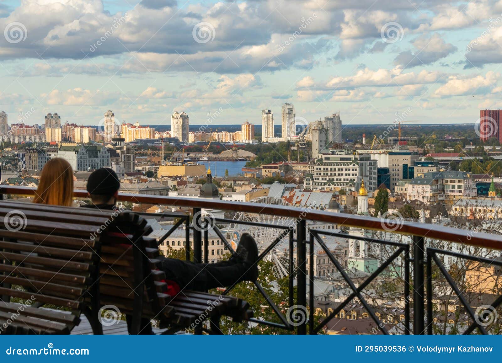 Kyiv City, Ukraine - October 10, 2022: People Sit on a Bench and Look ...