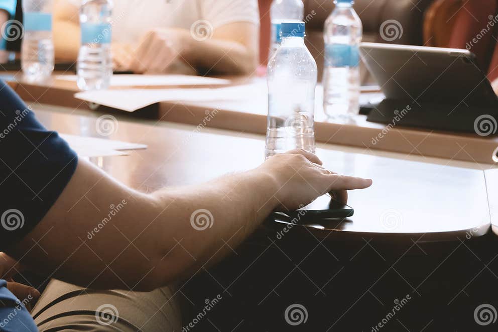People Sit at the Table Facing Each Other Stock Photo - Image of ...