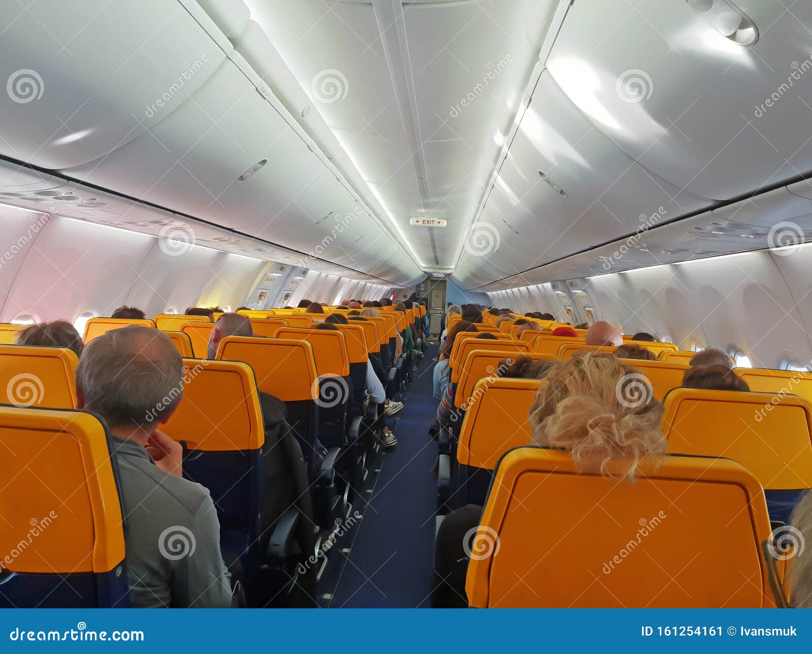 People are Sitting in an Airplane Cabin Stock Image - Image of seats ...
