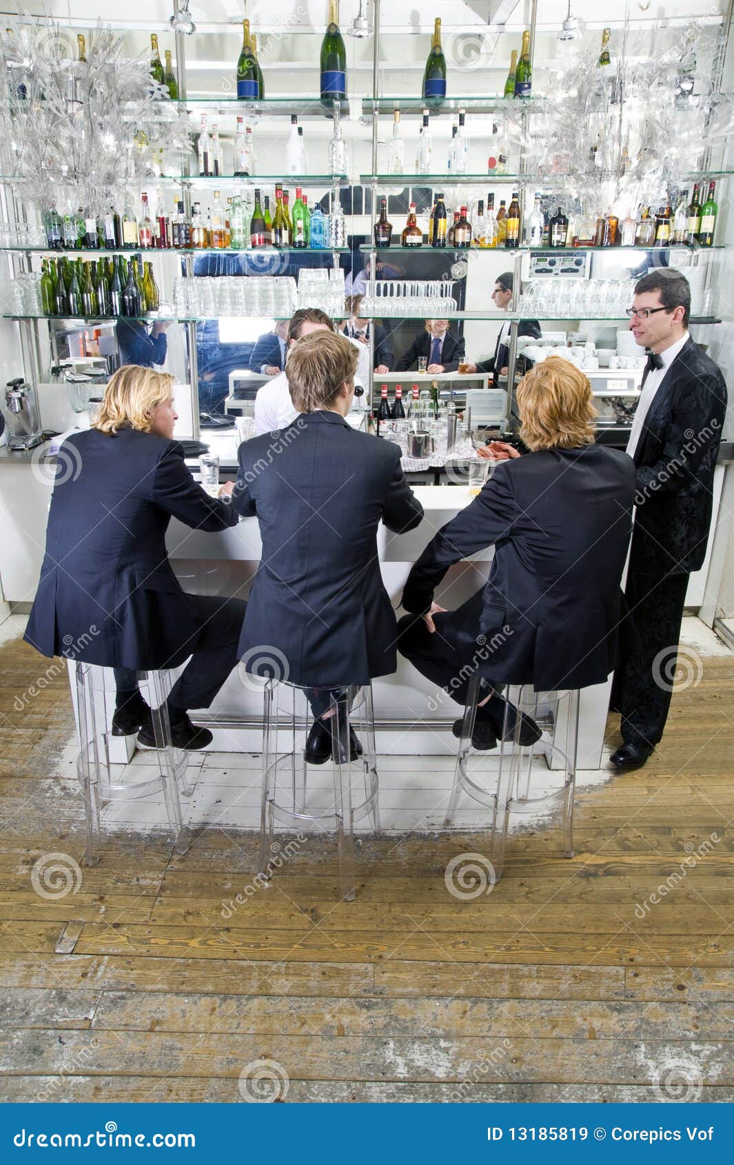 People sitting at a bar stock image. Image of beverage - 13185819