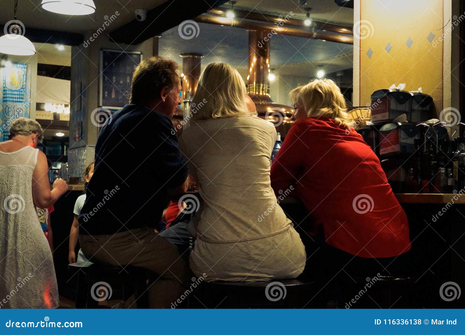 People sitting in bar editorial stock photo. Image of party - 116336138