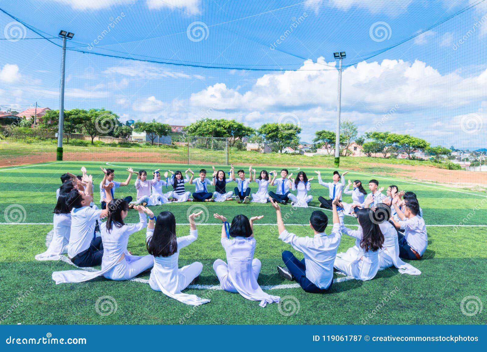 People Sitting On Green Grass Field Picture. Image: 119061787