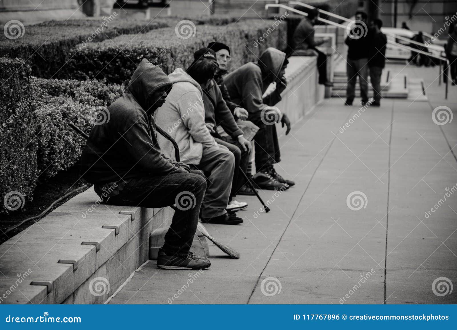 People Sitting Near The Garden Picture. Image: 117767896