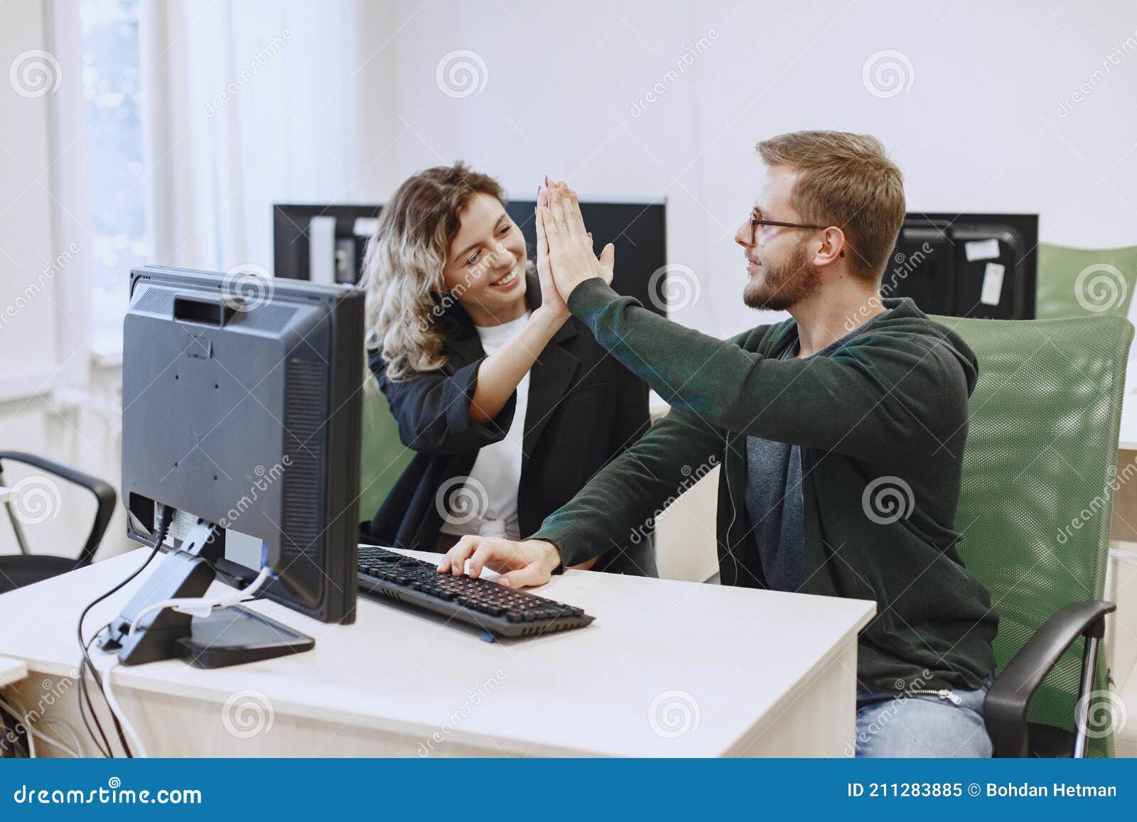 People Sitting at a Table in a Computer Room. Stock Image - Image of ...