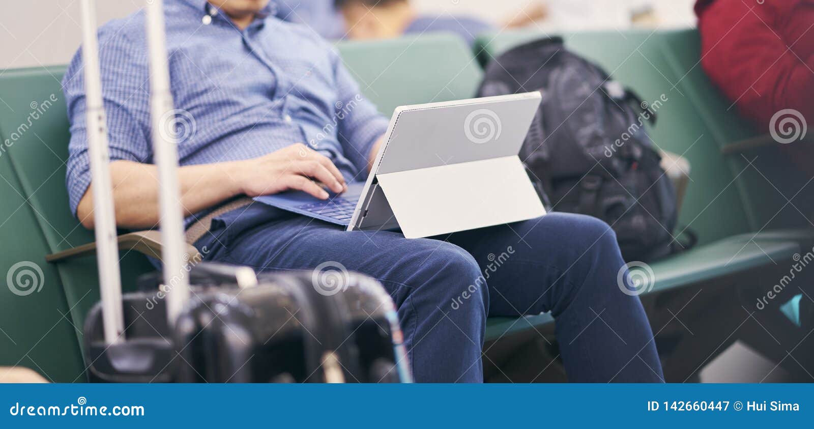 People Sitting and Working on Tablet when Waiting for Delayed Flight ...