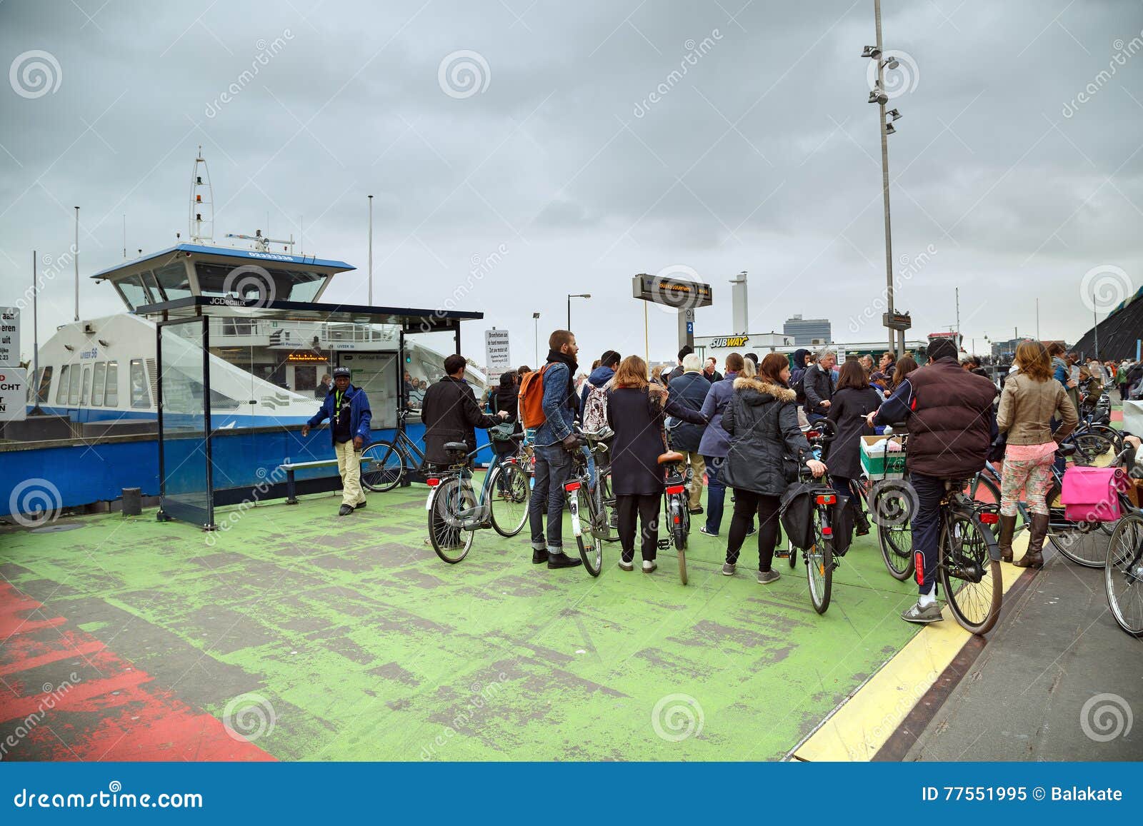 People Stand in the Queue for the Ferry Across the River in Amsterdam ...