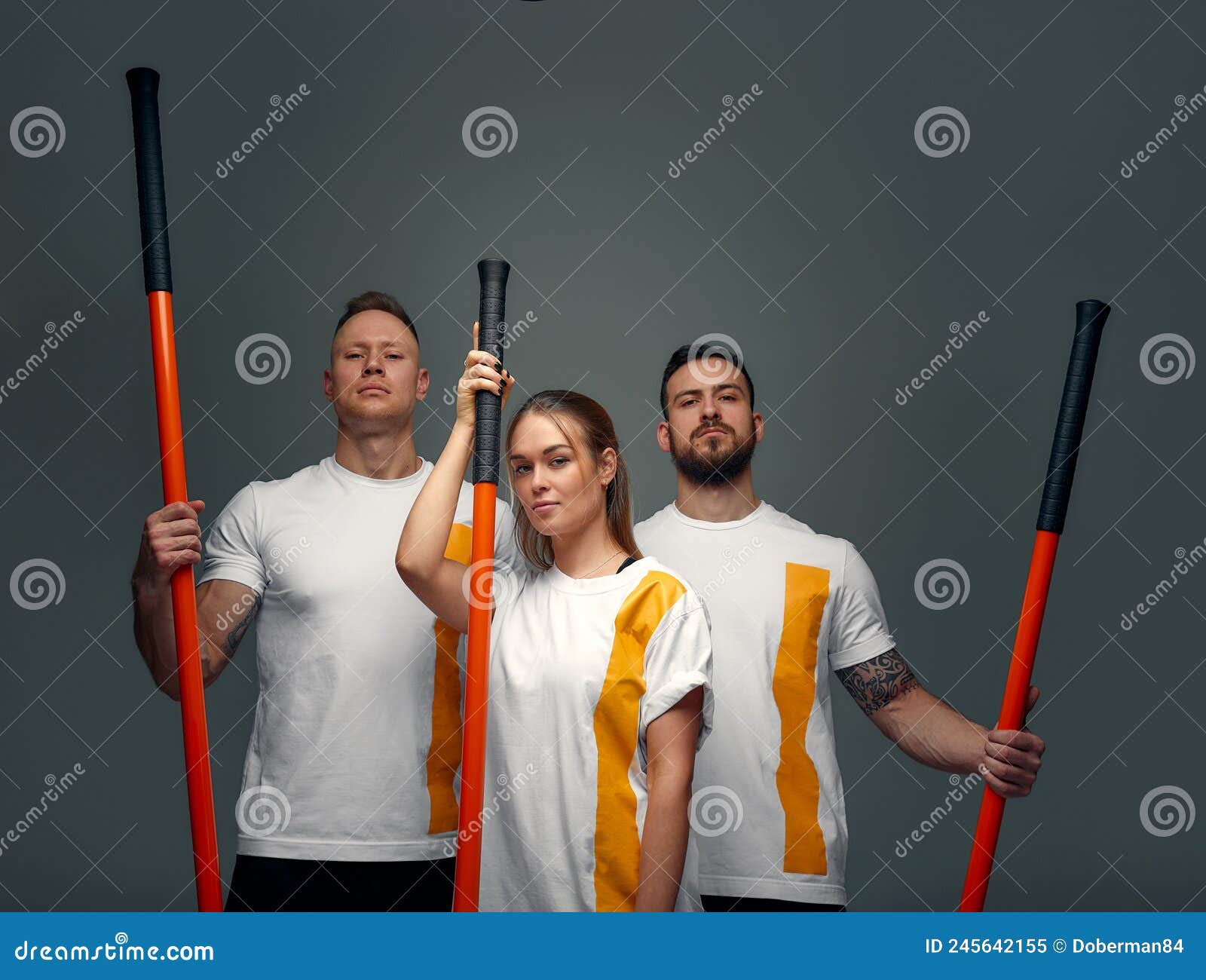 People Stand Together and Practice Sticks. Karate Masters Posing with ...