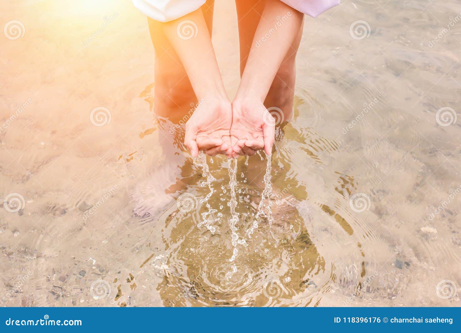 People Stand in the Water and Hands Fetch Water and Have Water Splash ...