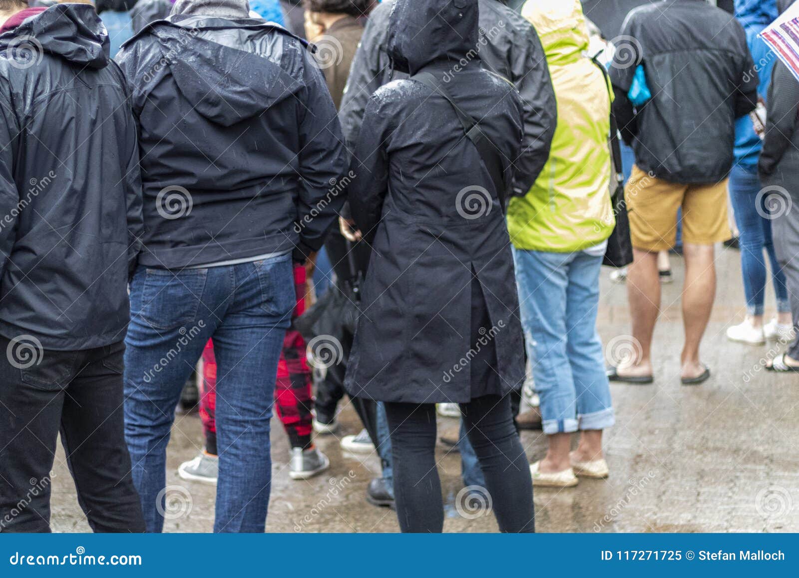 People standing in a crowd editorial image. Image of holding - 117271725