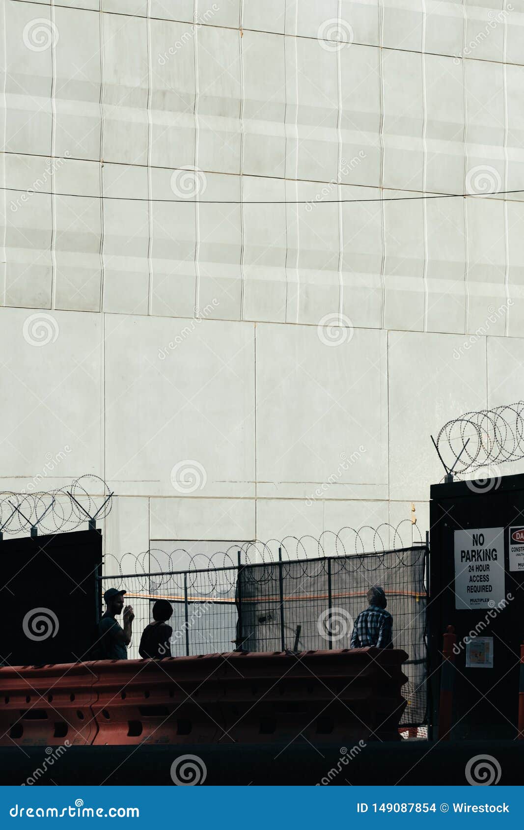 People Standing in Front of a Barbed Wire Fence Editorial Stock Image ...