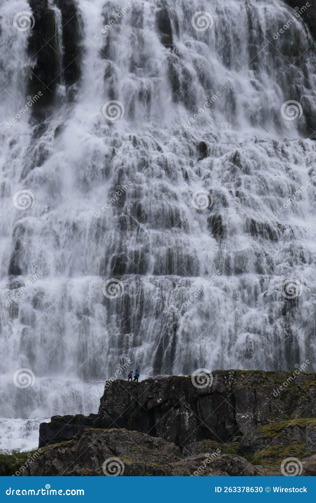2 People Standing in Front of Huge Waterfall Stock Photo - Image of ...
