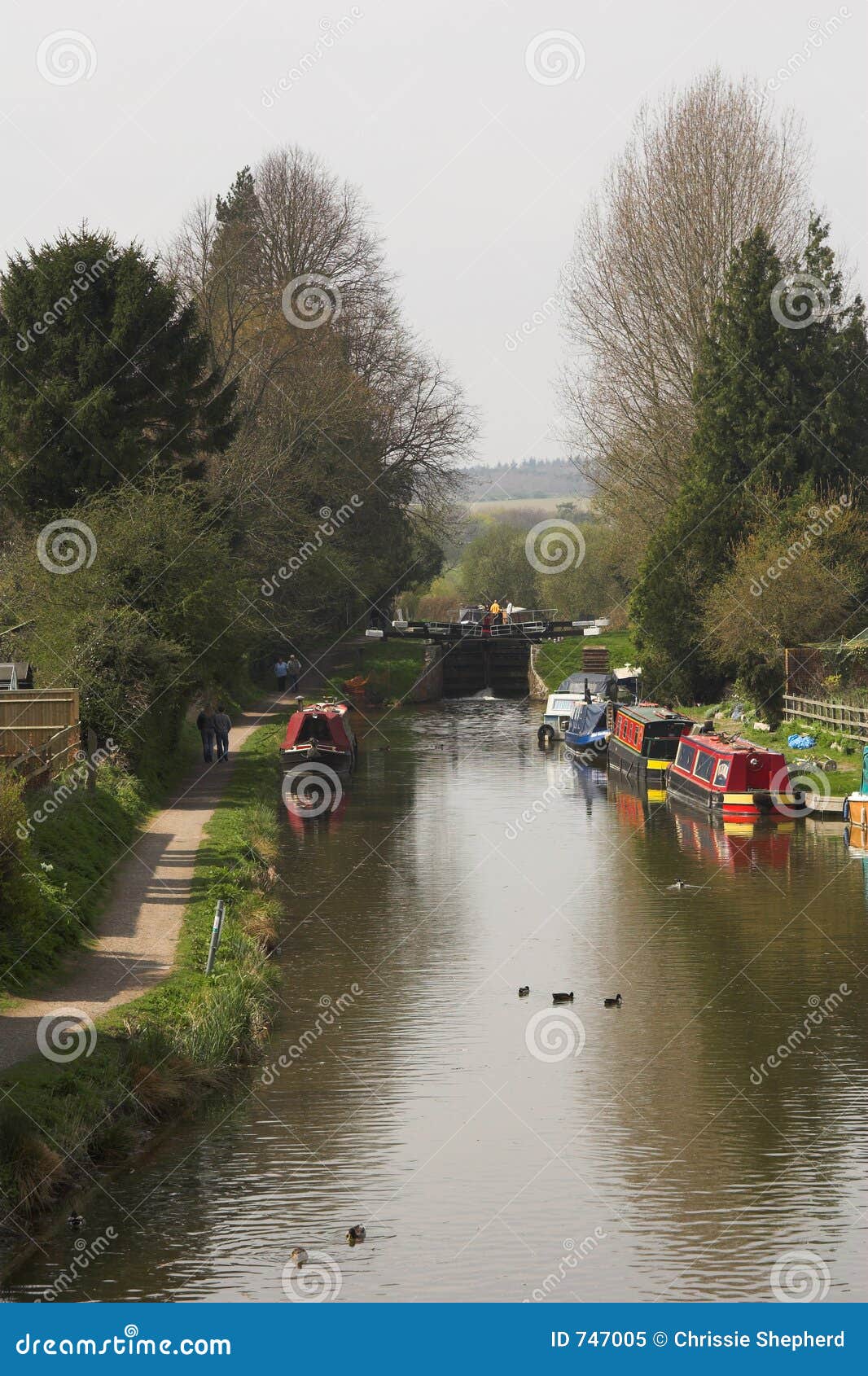 People Strolling Along River Stock Image - Image of peaceful, towpath ...