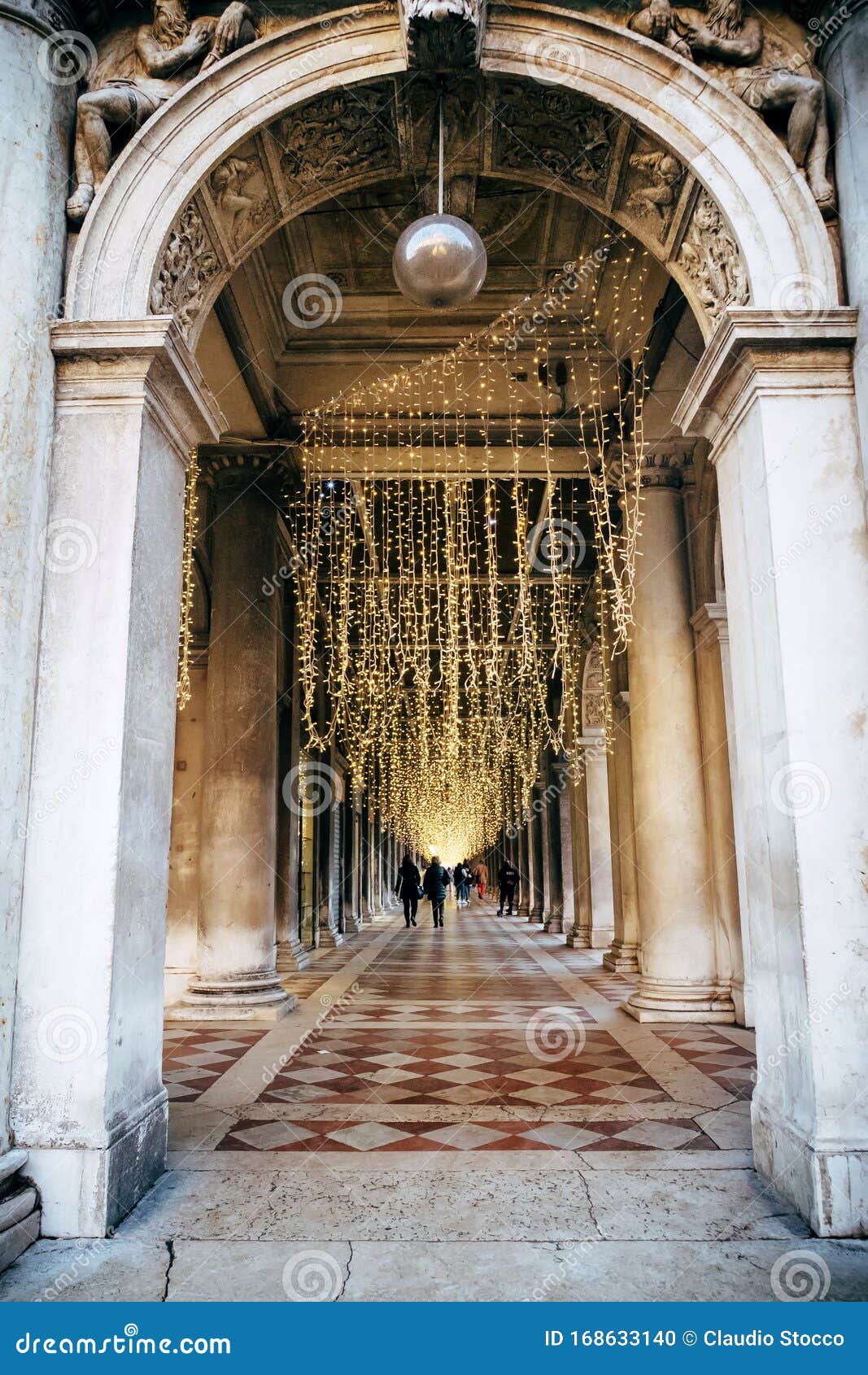 People Strolling Under the Arcades Illuminated by the Bright Christmas ... People Strolling Under the Arcades Illuminated by the Bright Christmas ...