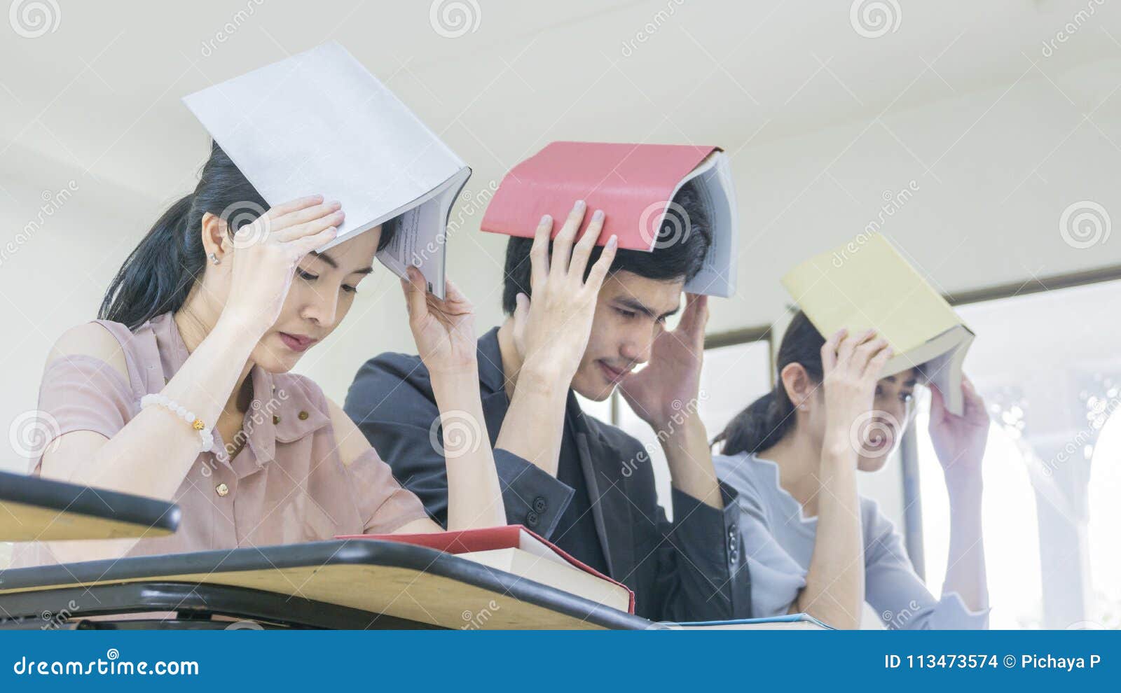 People Student Read Book and Hold Over Head and Sit Lecture Chairs ...