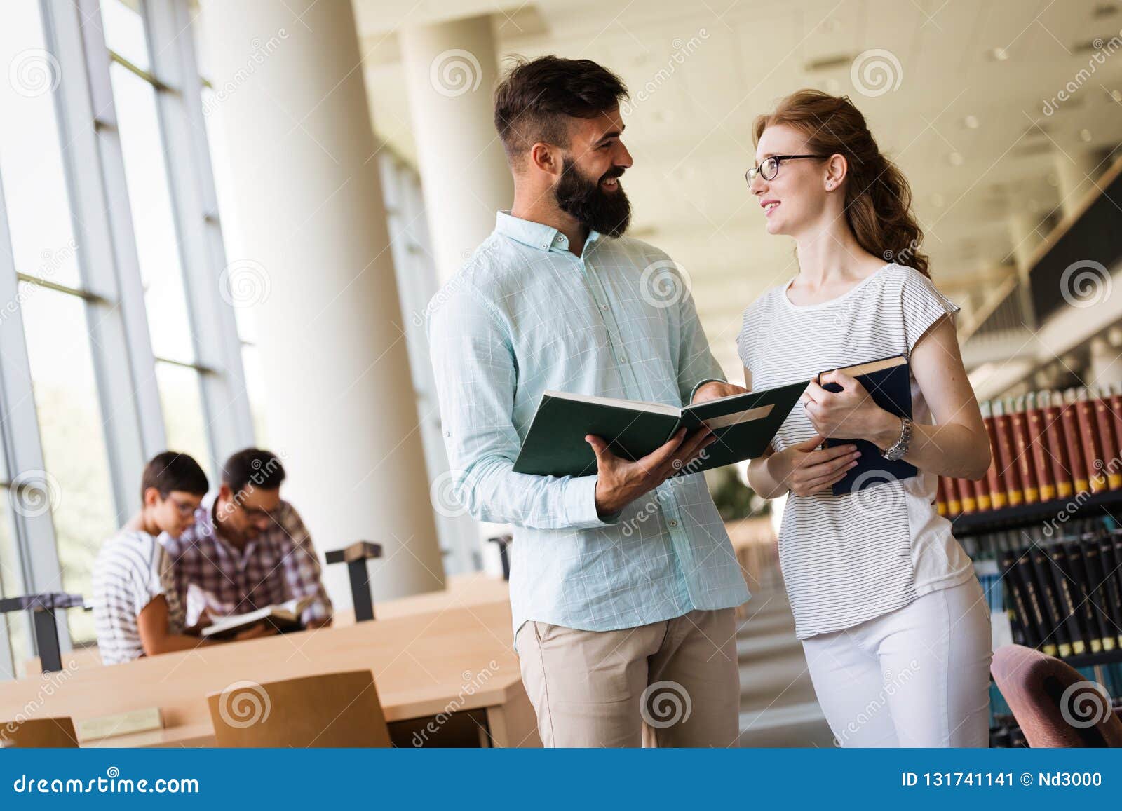 People Studying Together in a Modern Library Stock Image - Image of ...
