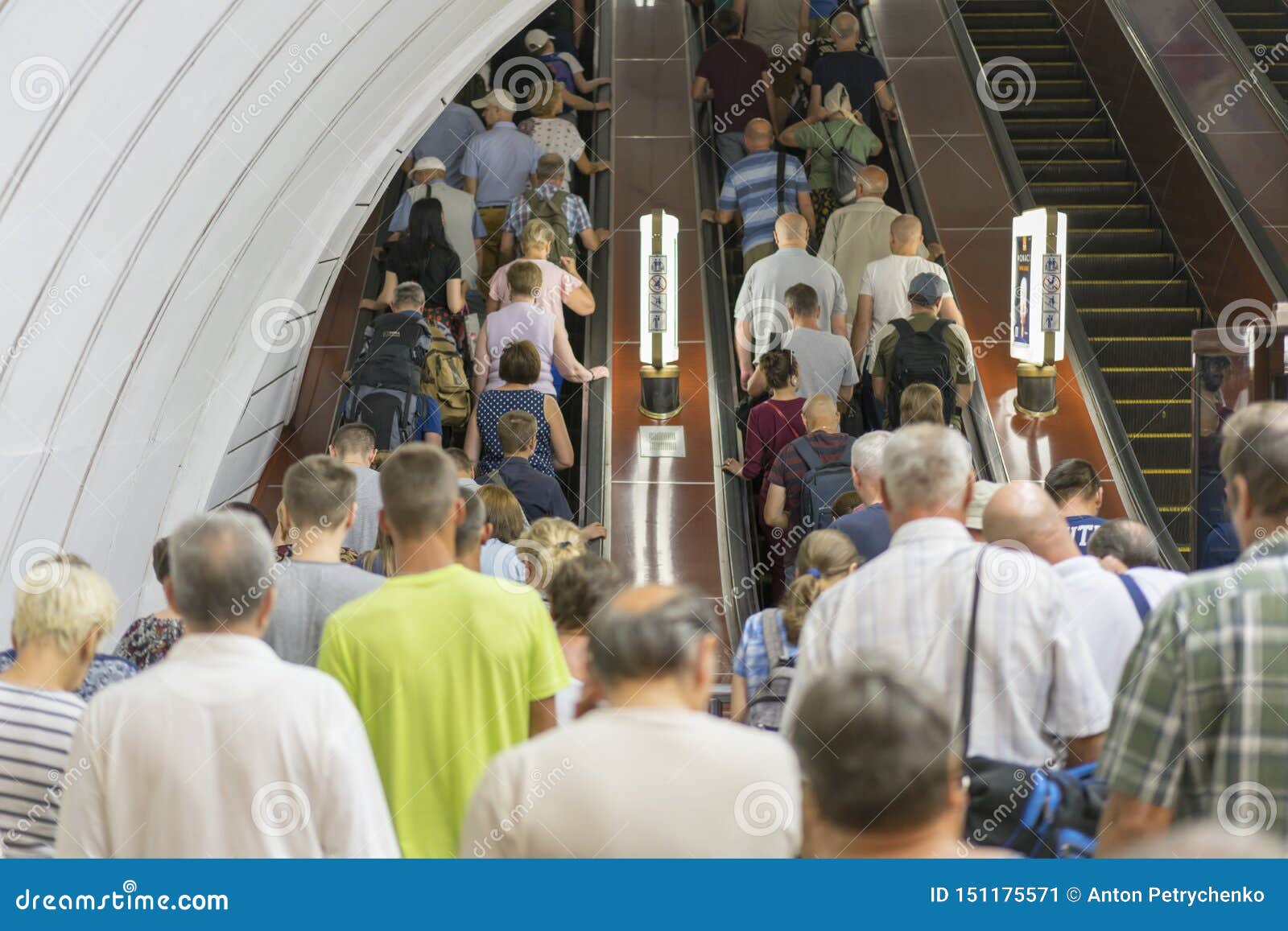 People in the Subway on the Escalator. a Crowd of People on the Stairs ...