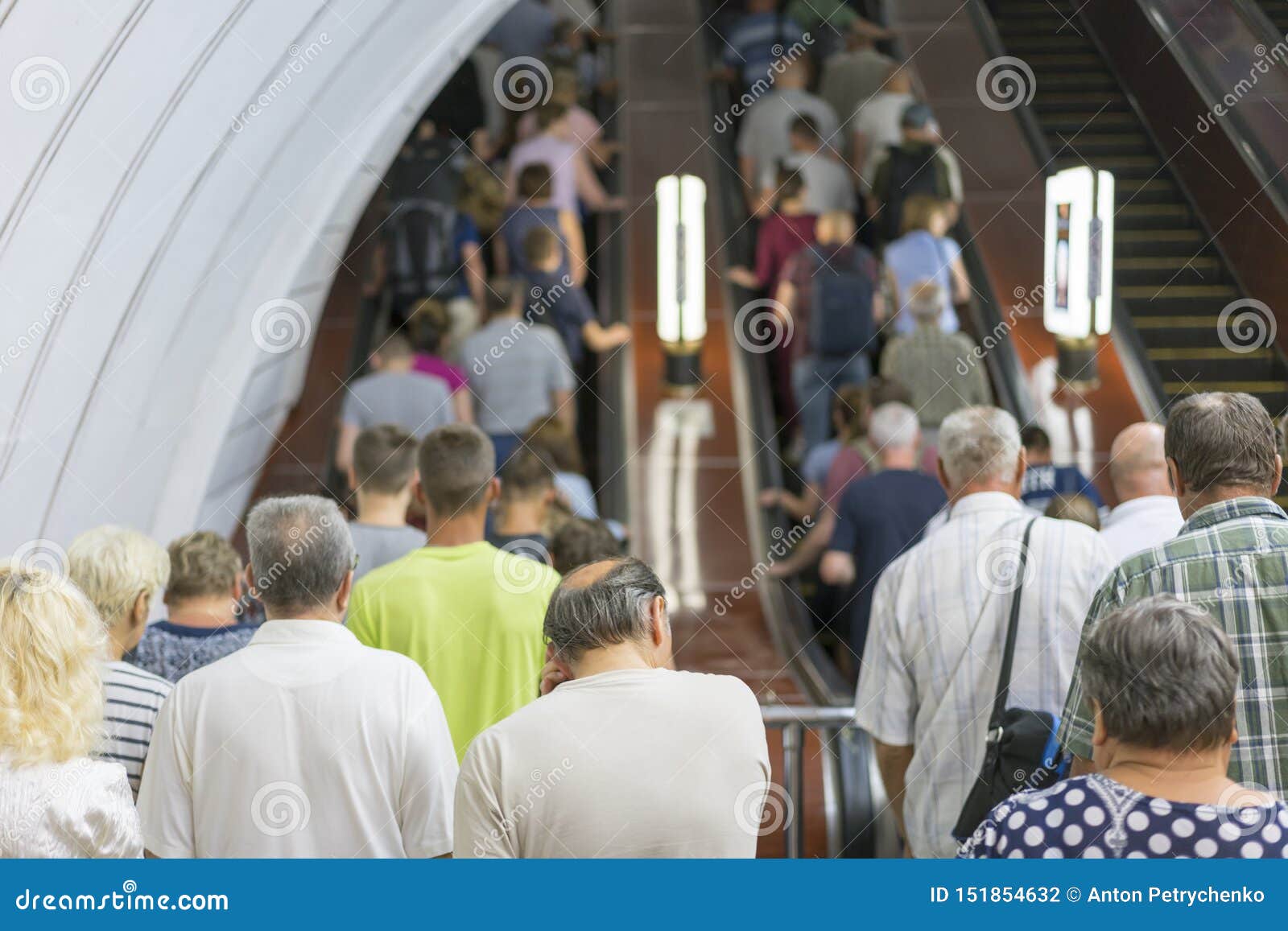 People in the Subway on the Escalator. a Crowd of People on the Stairs ...