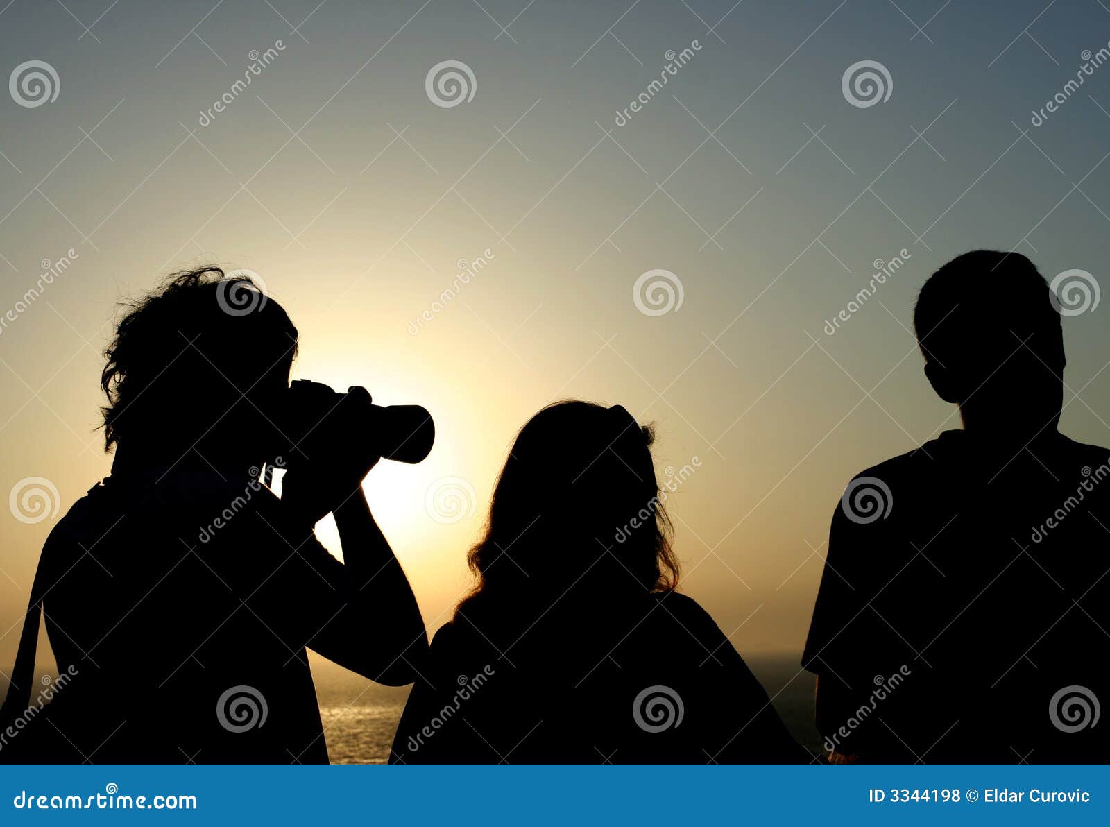 People in the sunset stock photo. Image of three, people - 3344198