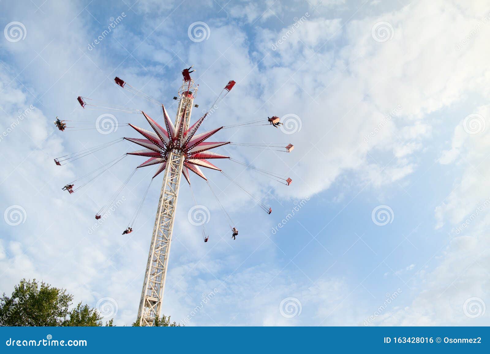 People Swinging on Big Swing at Amusement Park Stock Photo - Image of ...