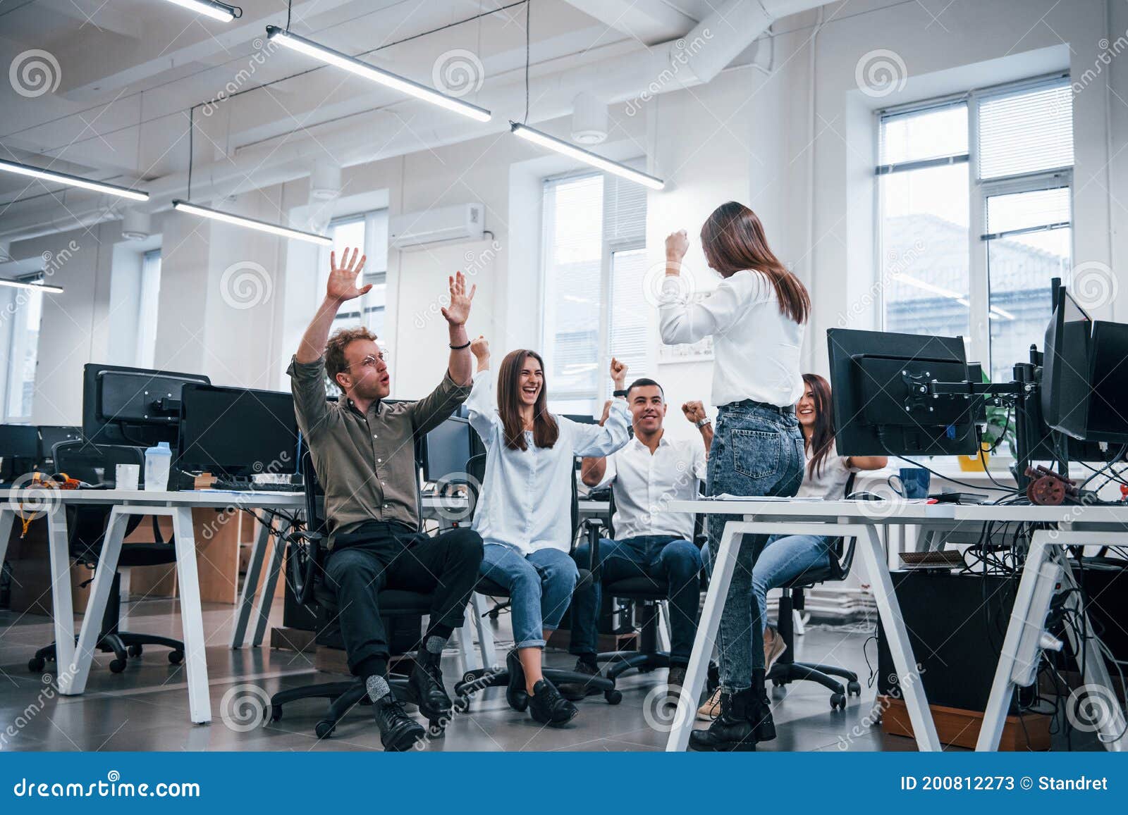 People Talking and Working Together in the Modern Office Near Computers ...