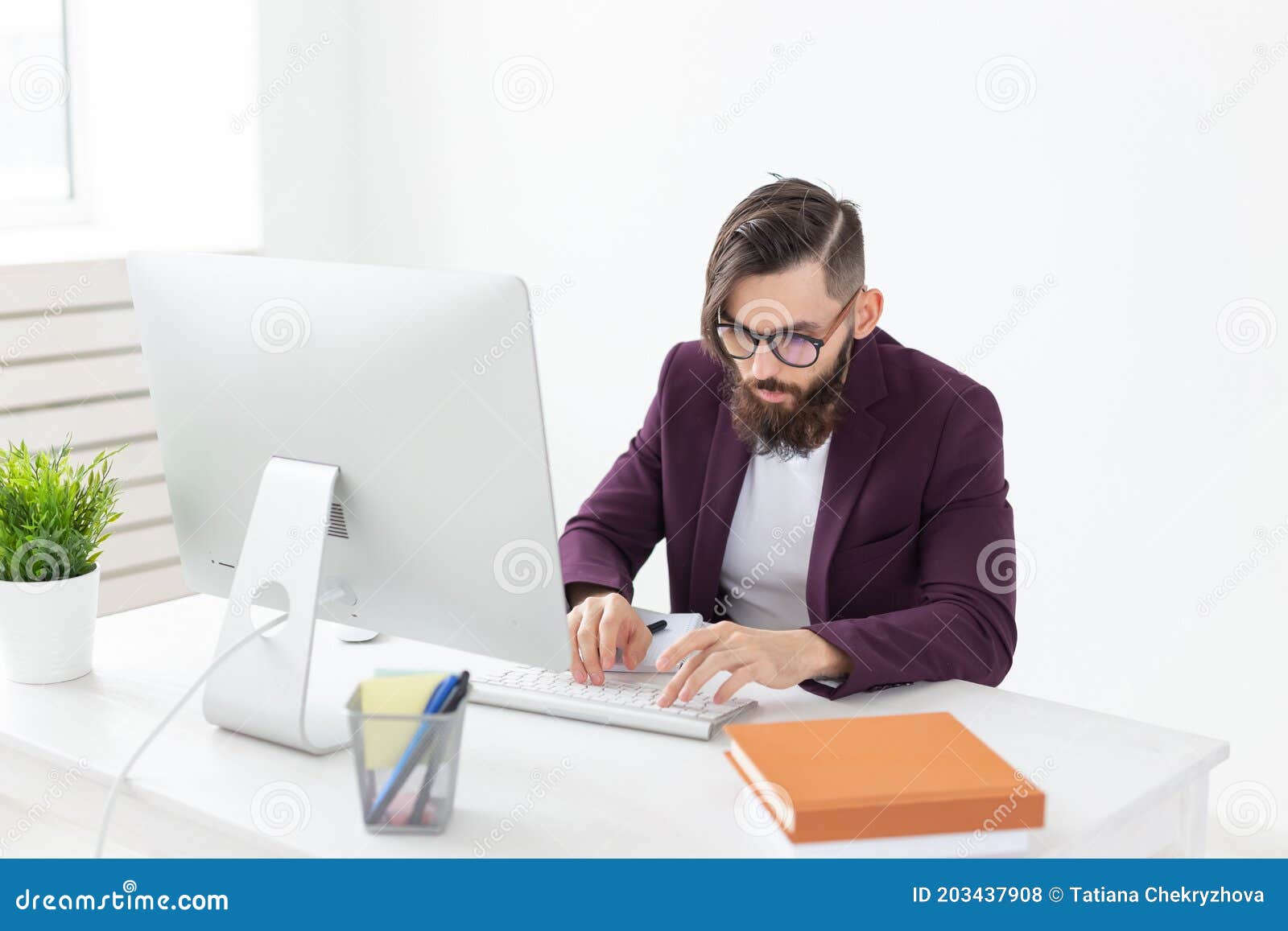 People and Technology Concept - Attractive Man with Beard Working on at ...