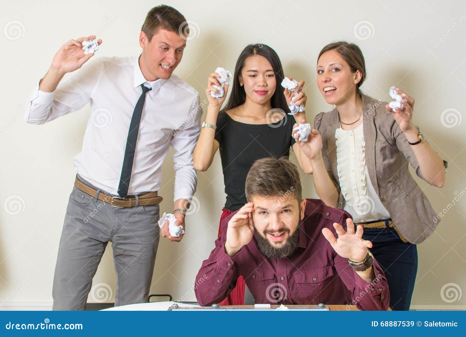 People Throwing Papers on a Colleague Stock Image - Image of people ...