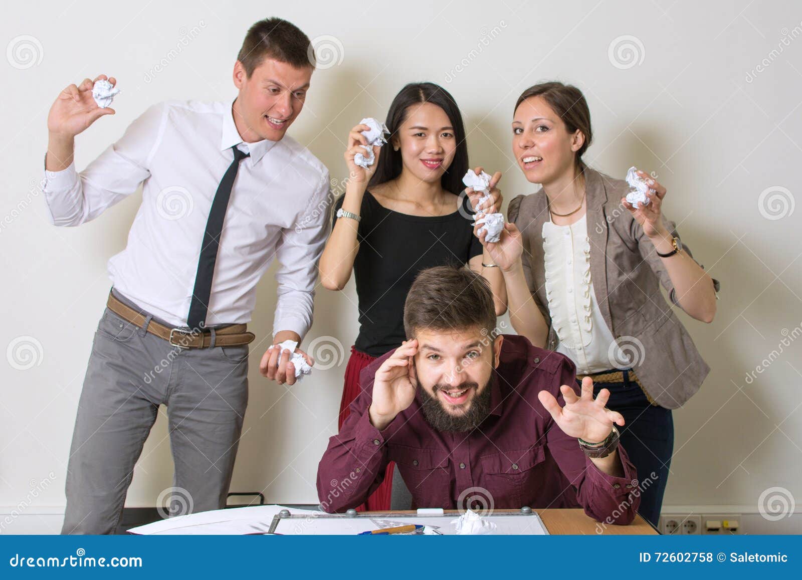 People Throwing Papers on a Colleague Stock Photo - Image of people ...