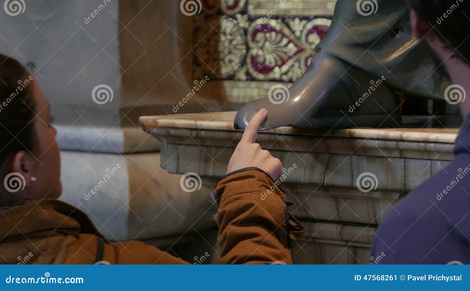 People touching statue leg stock video. Video of monument - 47568261