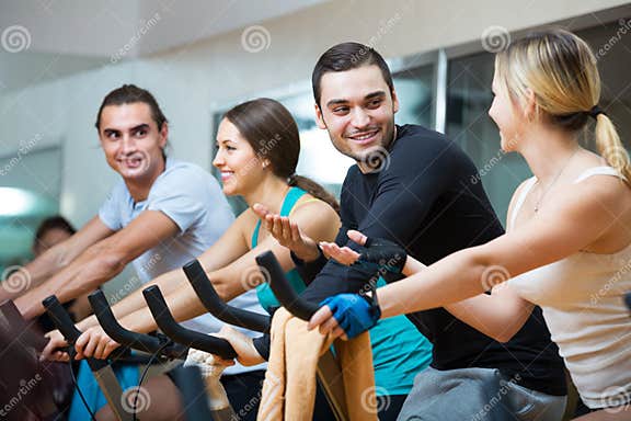 People Training on Exercise Bikes Stock Image - Image of movement ...