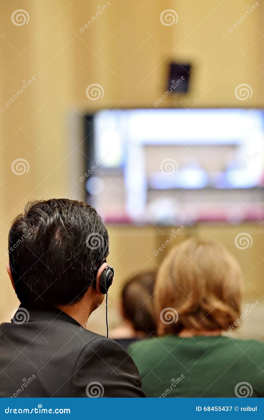 People Uing Translation Headphones during Video Presentation Editorial ...
