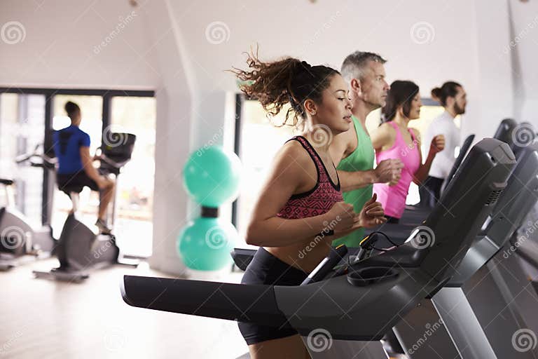 People Using Equipment in Busy Gym Stock Photo - Image of hispanic ...