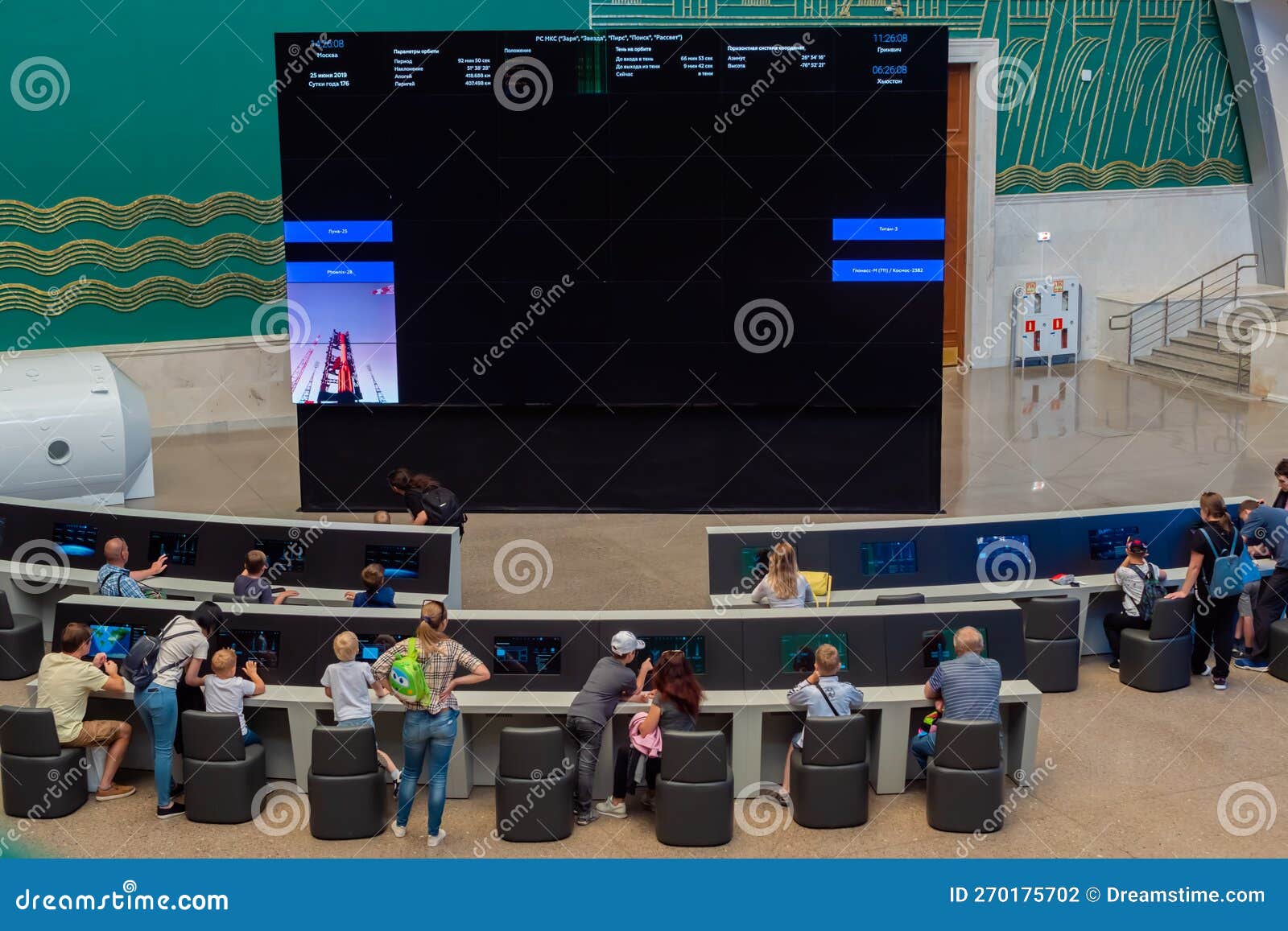 People Using Interactive Touchscreen Electronic Kiosks in Front of ...