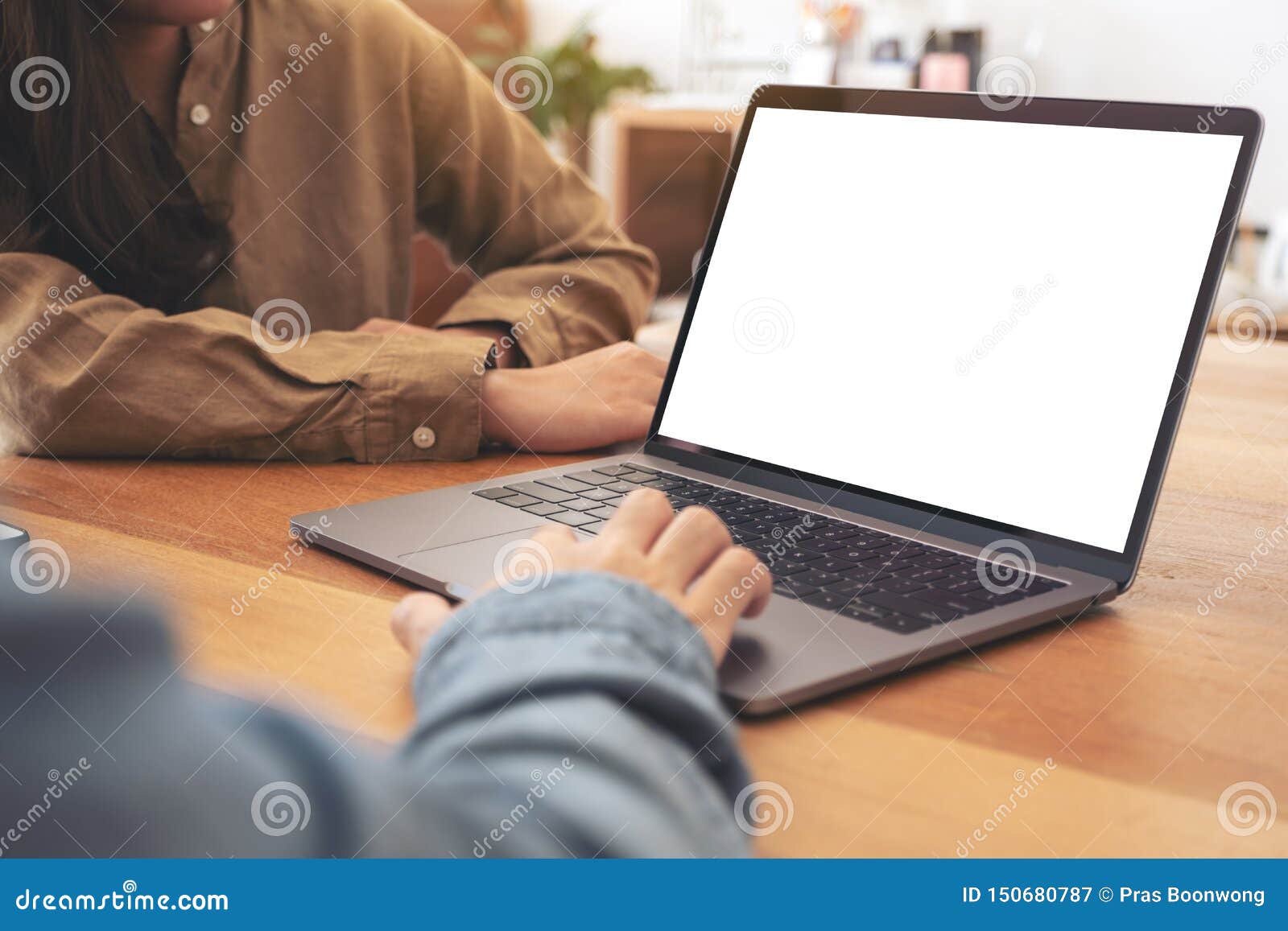 People Using and Looking at Mockup Laptop Computer on Wooden Table ...