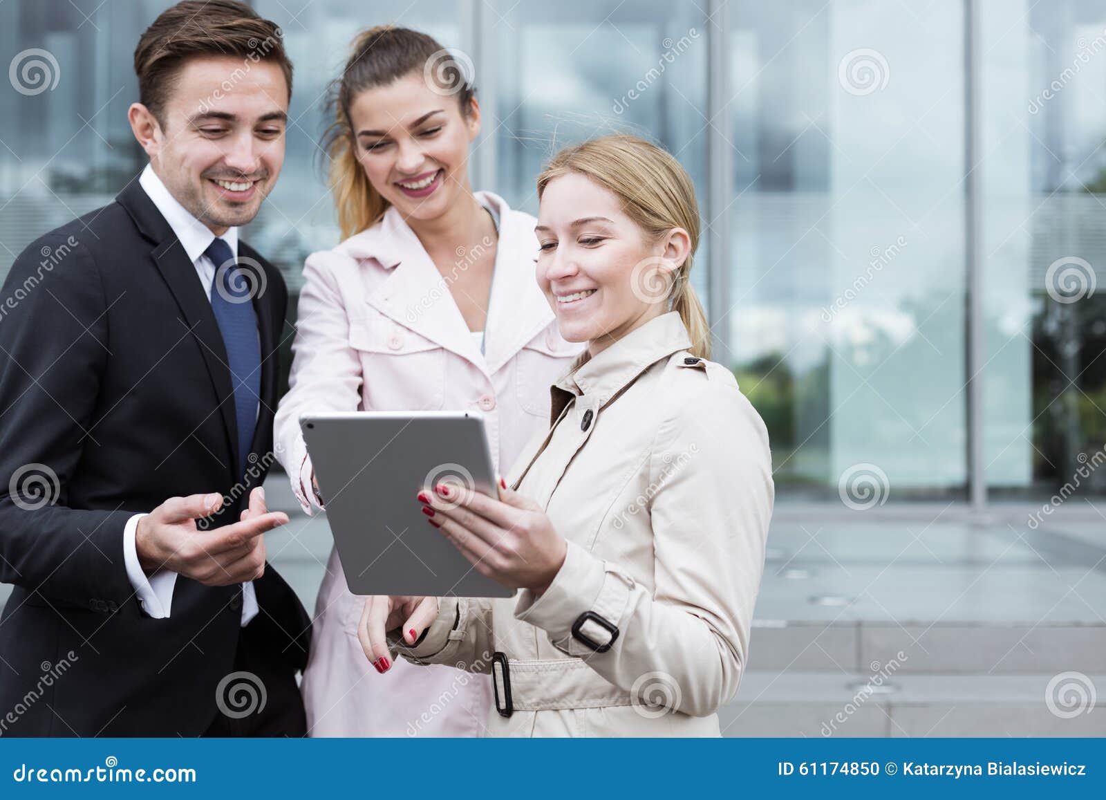 People using tablet stock photo. Image of smiling, outside - 61174850