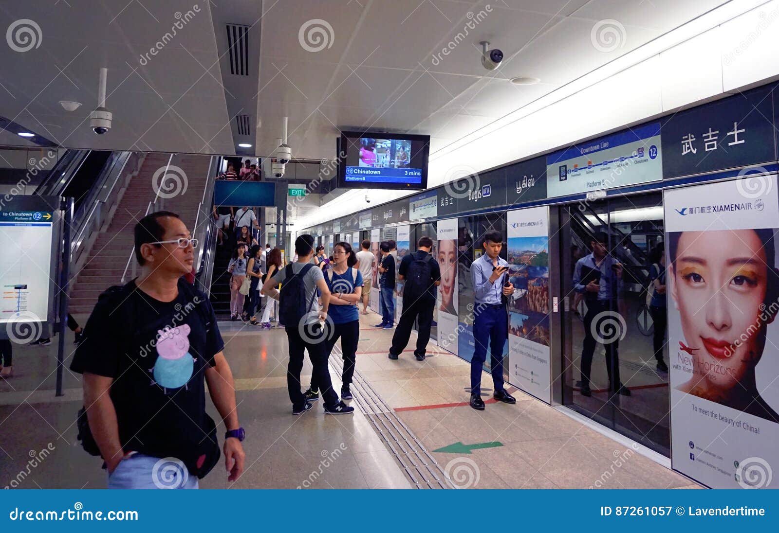 People Wait for a Train at the MRT Station Bugis in Singapore ...